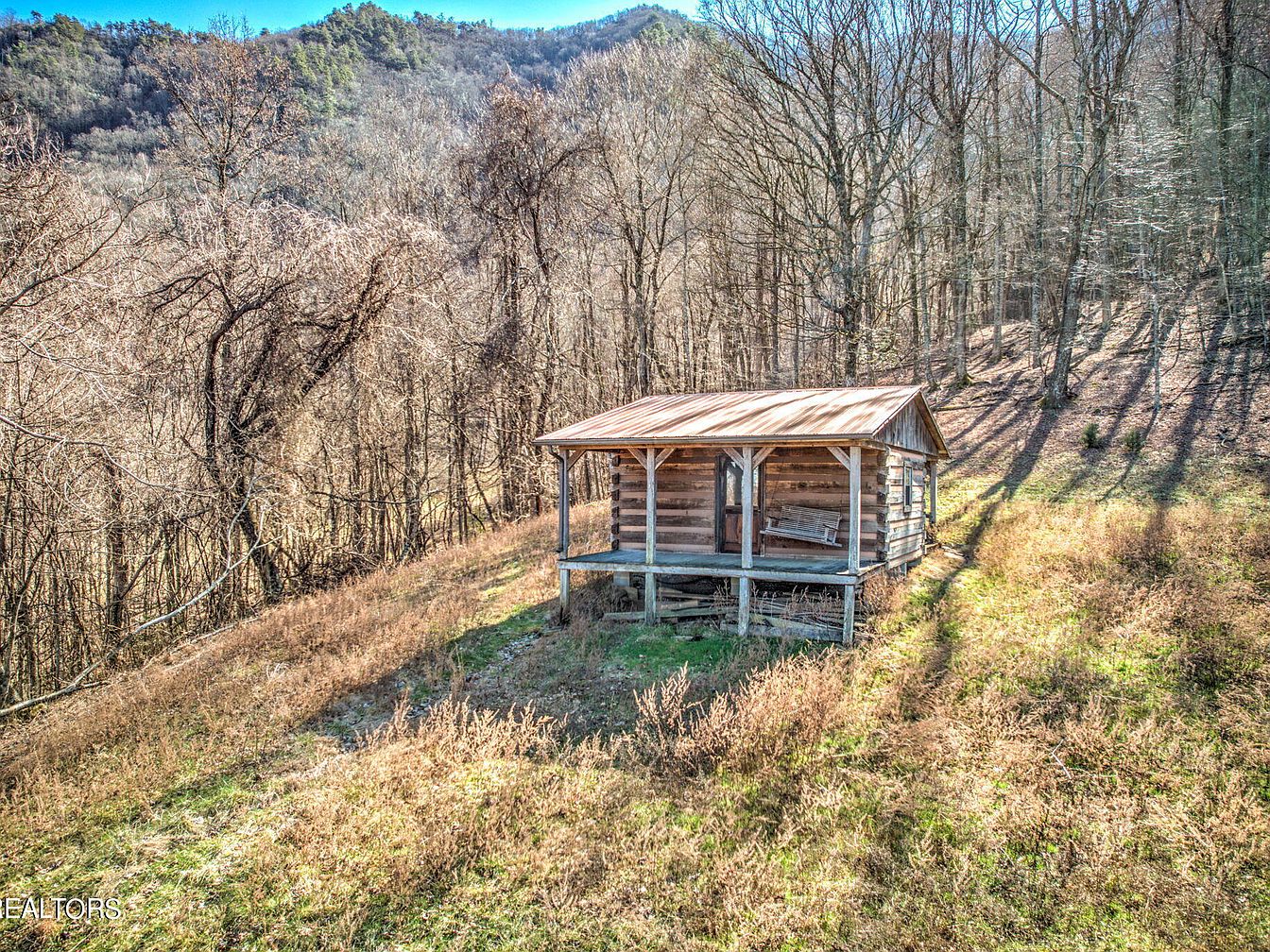 Discover a 1900 Farmhouse Oasis in Townsend, Tennessee with 160 Acres ...
